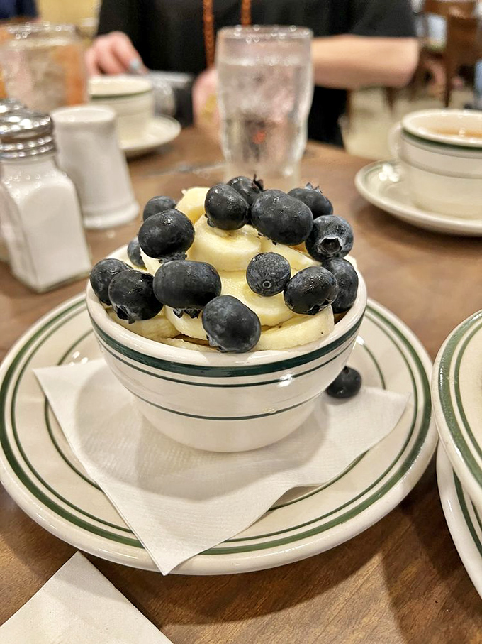 Pancake perfection isn't complicated—just a golden disc with crispy edges and a pat of butter melting into breakfast bliss. 