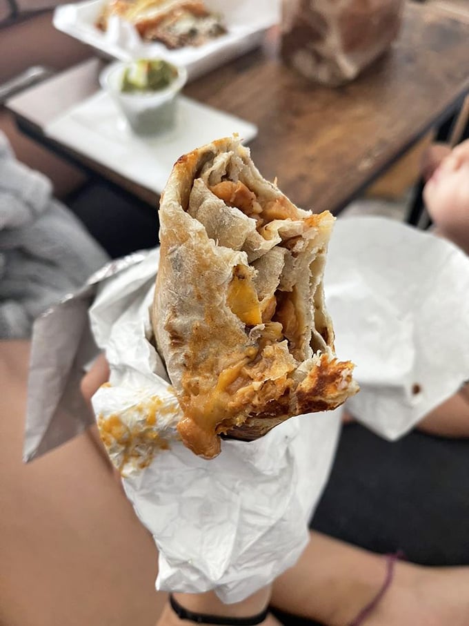 Simple pleasures done right – melted cheese embracing tender beans like they've been waiting their whole lives for this moment.
