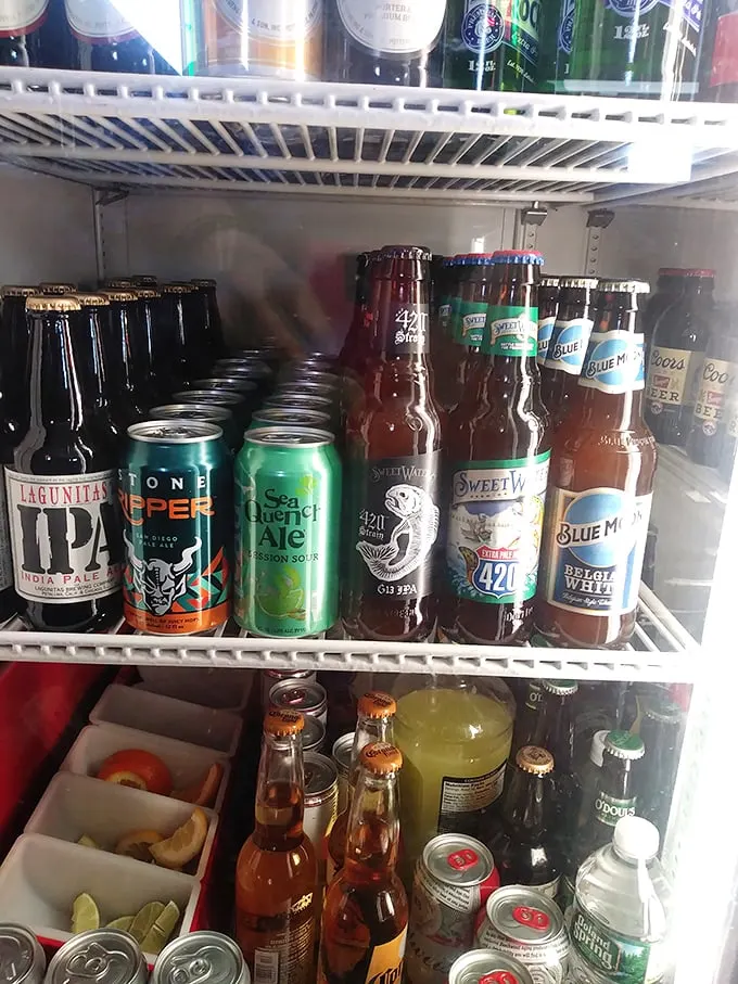 The beer selection covers all bases—from craft IPAs to classic lagers—because proper sandwich appreciation requires proper hydration.