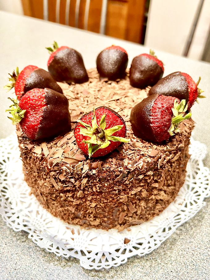 Chocolate-dipped strawberries standing guard around a chocolate fortress. This cake isn't just dessert—it's an edible work of art worth every calorie.