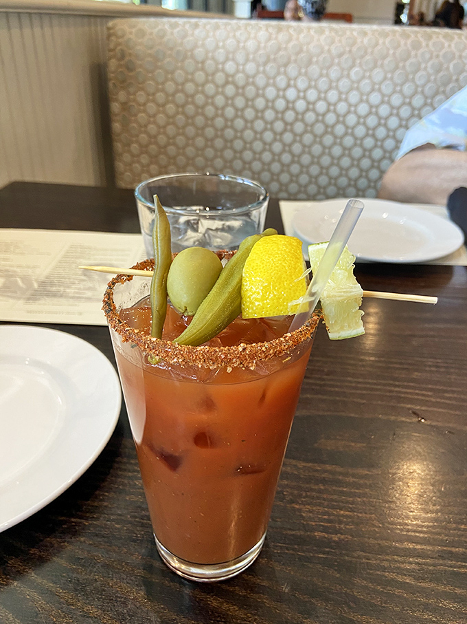 This isn't just a Bloody Mary—it's a garden in a glass with enough garnishes to count as a small appetizer.