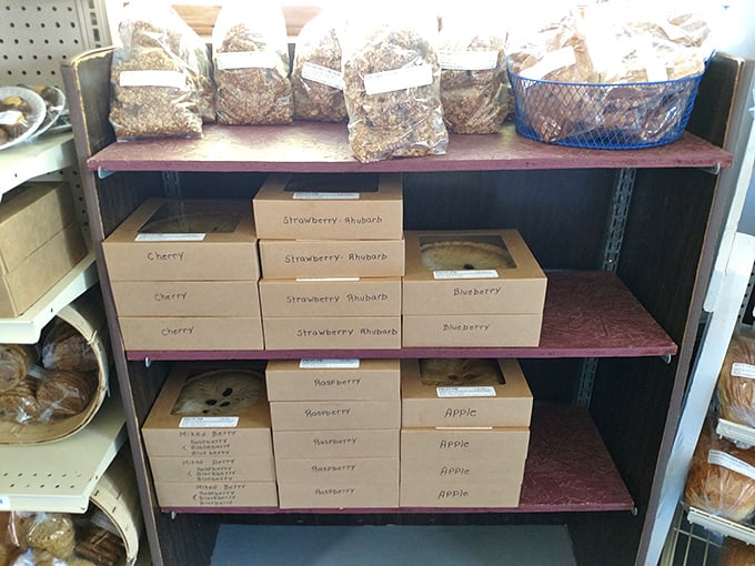 Neat rows of boxed pies waiting for their forever homes—each labeled with care and containing more comfort than most therapy sessions.