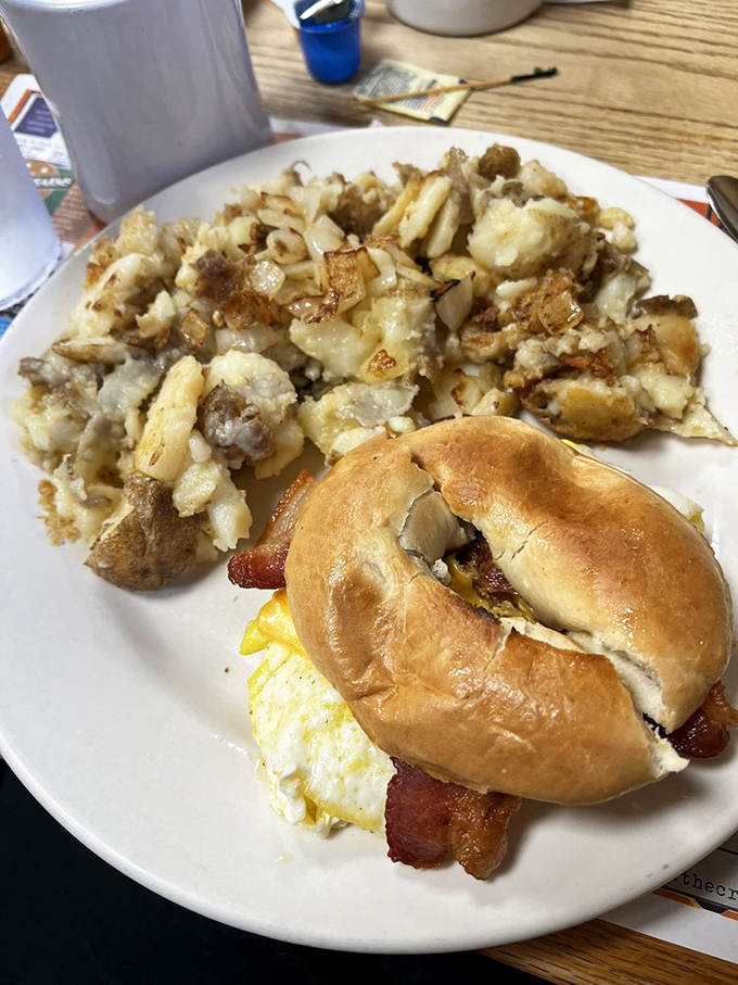The breakfast sandwich and home fries – proof that sometimes the simplest combinations create the most profound happiness before noon.