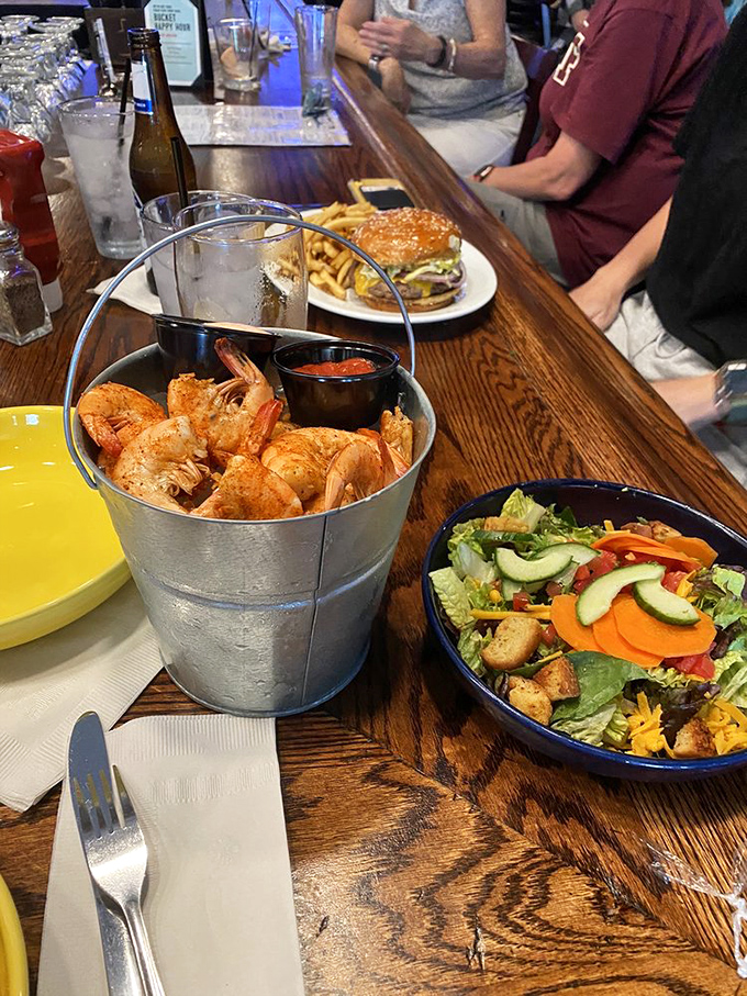 A literal bucket of perfectly seasoned shrimp—because sometimes subtlety is overrated and abundance is exactly what the soul requires.