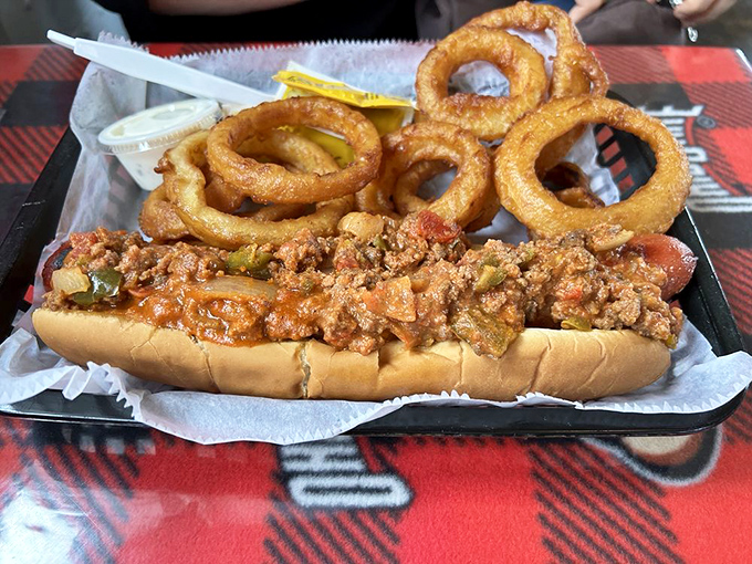 The Buckeye Mega Dog doesn't just satisfy hunger—it obliterates it. This chili-topped creation demands both hands and extra napkins.