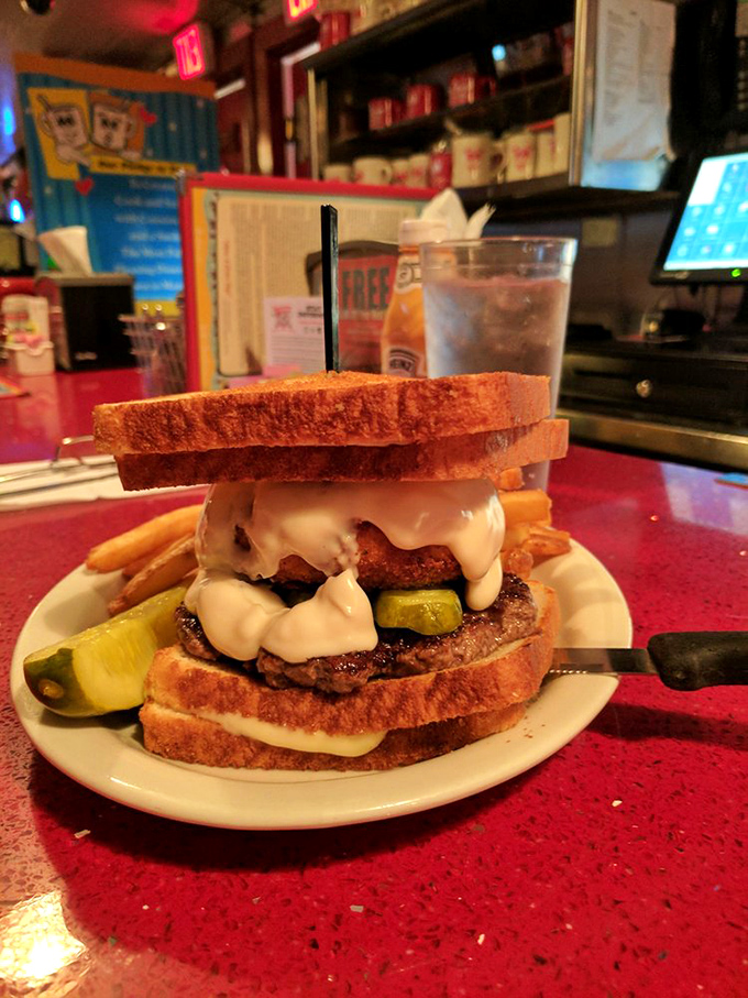 Not sure if it's a burger or an engineering marvel—meat and pickles sandwiched between two grilled cheeses. America's answer to the Eiffel Tower.