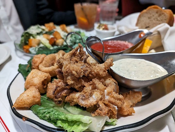 Crispy calamari that shatters at first bite, served with dipping sauces that make you wonder why anyone would ever share this starter.