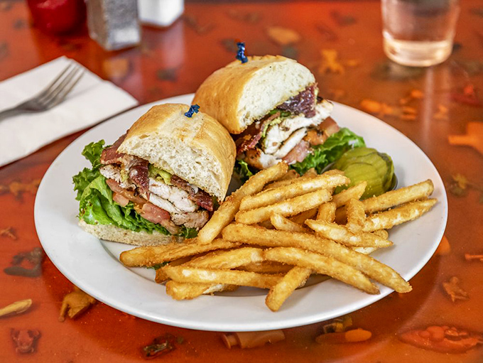 A sandwich that could be California's official state food – golden chicken, crisp lettuce, and all the fixings with fries so perfect they deserve their own fan club.