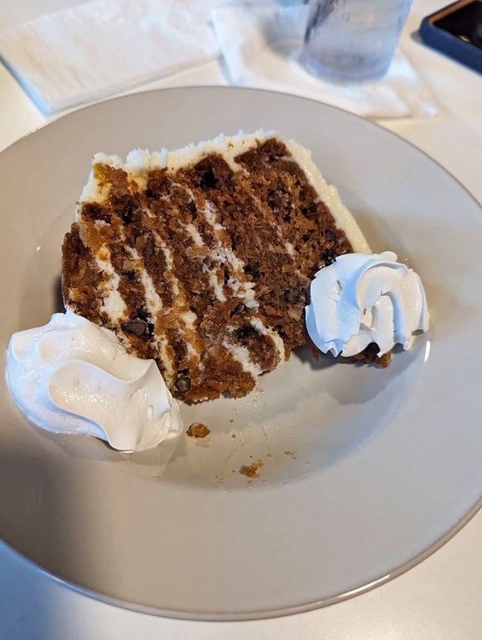 Layer upon layer of moist carrot cake with cream cheese frosting—the kind of dessert that makes you consider skipping the main course next time.
