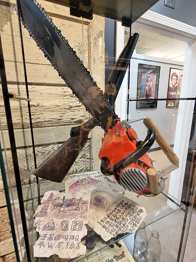 That's not your average gardening equipment—this display features screen-used weapons that dispatched the undead with cinematic flair.