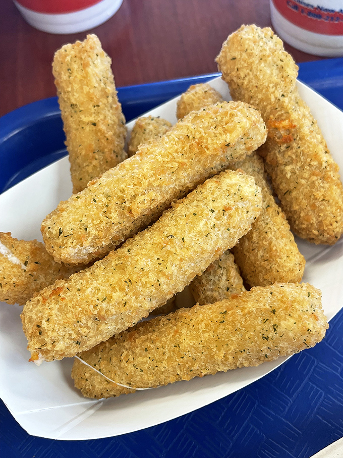 These aren't just cheese sticks—they're golden wands of happiness that transform ordinary days into celebrations with their crispy exteriors and molten centers.