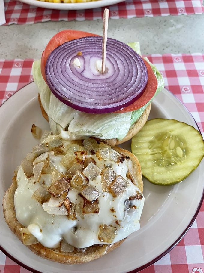 This isn't just a burger—it's an open-faced love affair with melted cheese, grilled onions, and zero pretension.