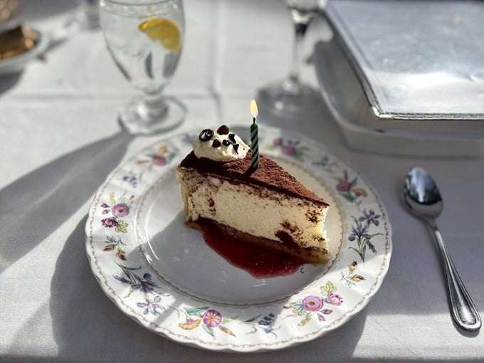 A slice of cheesecake with a birthday candle—because any day you eat this well deserves celebration.