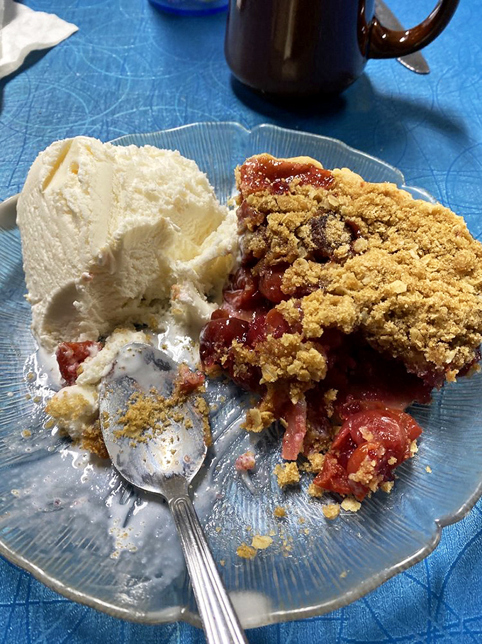 A scoop of vanilla ice cream melts into warm cherry pie, creating that perfect hot-cold symphony that makes taste buds applaud.
