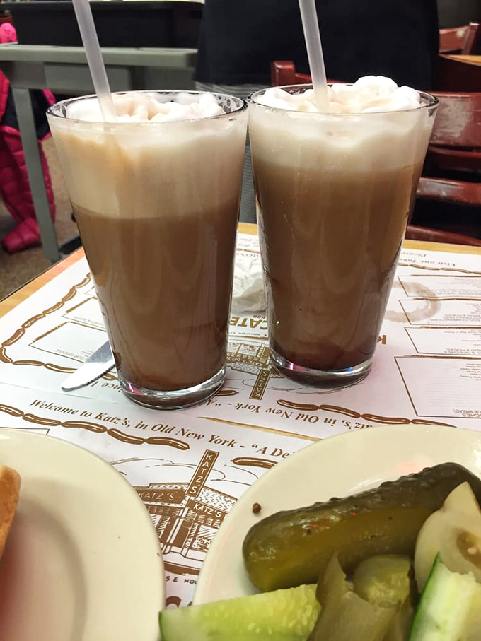 Chocolate egg creams – no eggs, minimal chocolate, maximum nostalgia. These frothy delights are the unofficial beverage of old-school New York.
