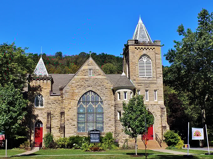 This stone church with its striking stained glass proves that small towns often hide architectural treasures worthy of European postcards.