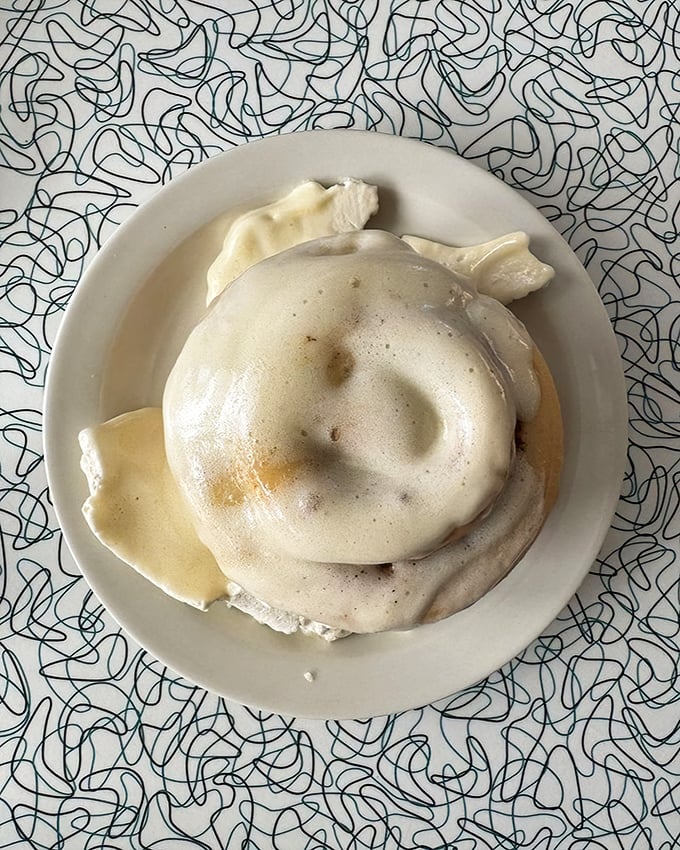 Behold the cinnamon roll, gloriously blanketed in cream cheese frosting. Diet culture has no power in the presence of this magnificent spiral of happiness.