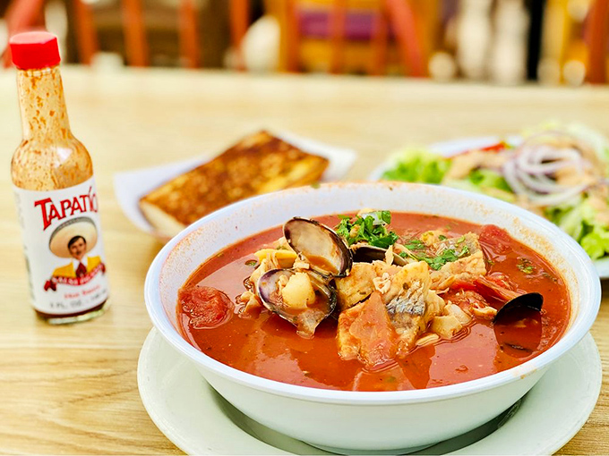 Cioppino that would make Italian fishermen weep with joy – a tomato-rich sea of treasures where each spoonful delivers a different oceanic surprise. Don't forget the bread for sopping!