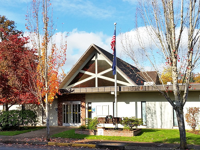 Cottage Grove's City Hall looks more like your successful uncle's cabin than a government building—complete with autumn trees that dress better than most of us.