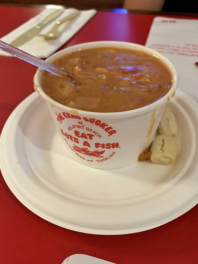 Manhattan clam chowder served in a cup that tells you to "Eat Lots of Fish"—advice worth following at this Newport Beach institution.
