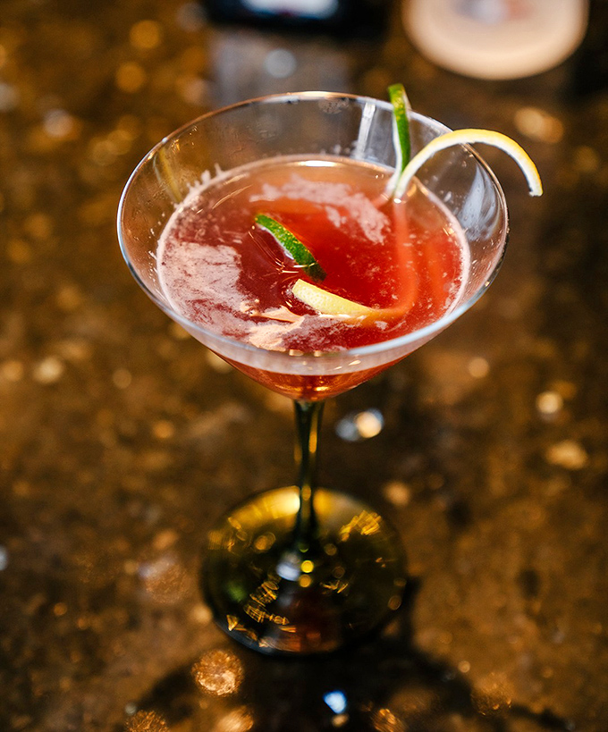 This isn't just a cocktail; it's liquid courage in a martini glass, dressed in crimson and ready for a night of sophisticated mischief.