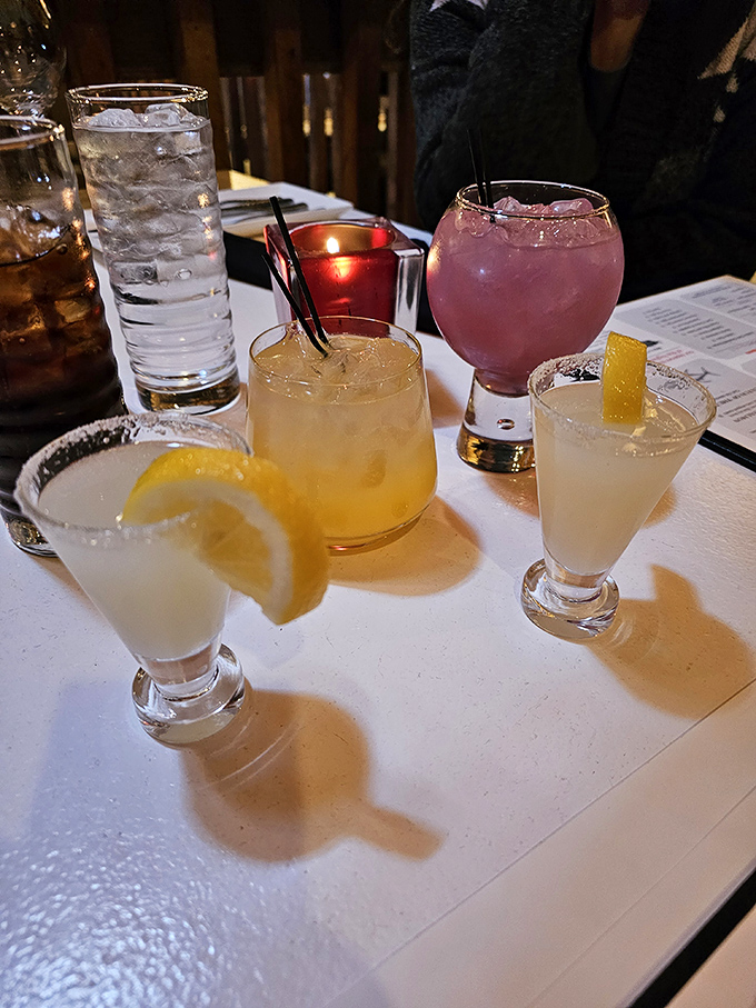 Cocktails that double as conversation pieces. From classic whiskey concoctions to that vibrant pink showstopper, each drink is crafted with Instagram-worthy precision.