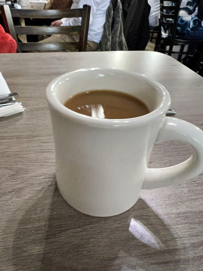 The humble diner coffee mug – unassuming vessel of liquid motivation that's kept America running since before energy drinks were a twinkle in a marketer's eye.