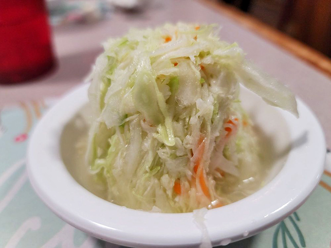 Vinegar-based coleslaw that cuts through the richness like a well-timed joke at Thanksgiving dinner. Simple, bright, and absolutely necessary.