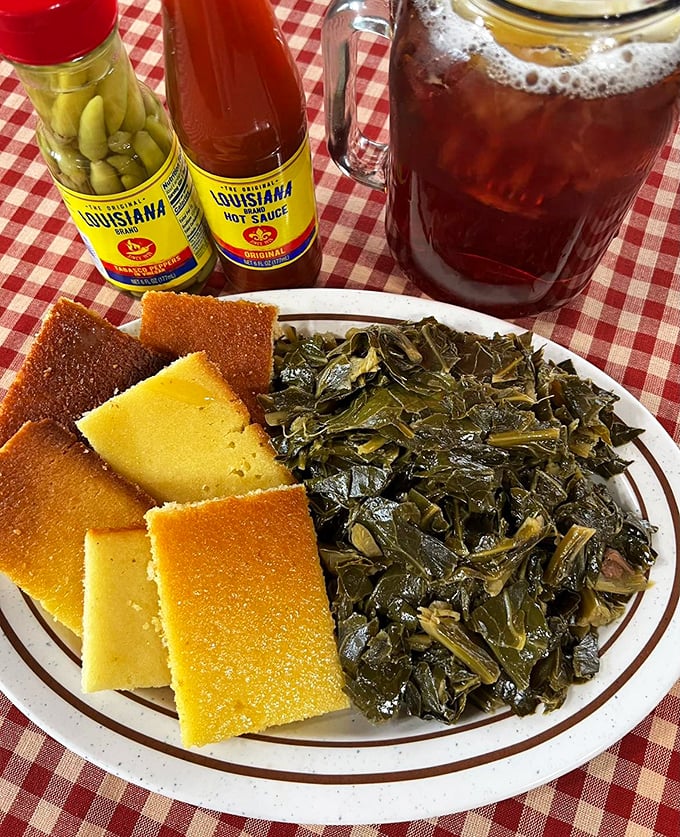 Collard greens swimming in pot likker with cornbread standing by for dipping duty. A Southern combination as timeless as sweet tea on a porch swing.
