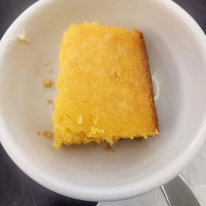Golden cornbread that crumbles just right - the perfect vehicle for soaking up every drop of gravy.