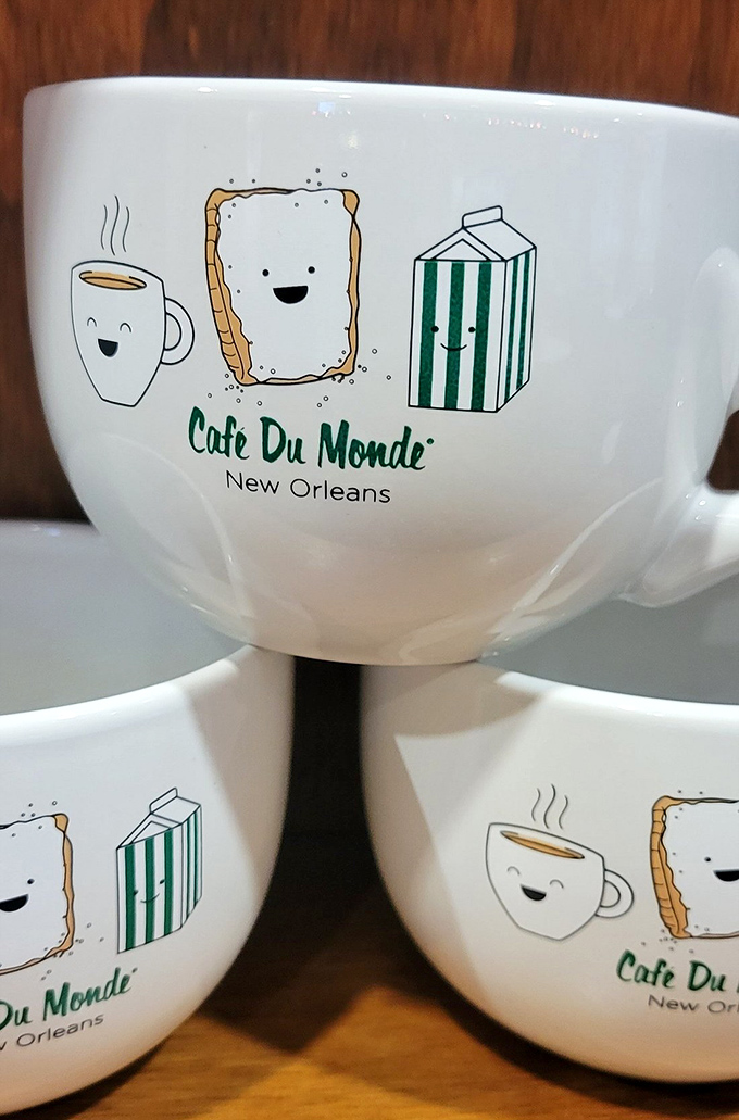Whimsical mugs featuring cartoon beignets with faces—because your pastry should smile back at you before you devour it without remorse.