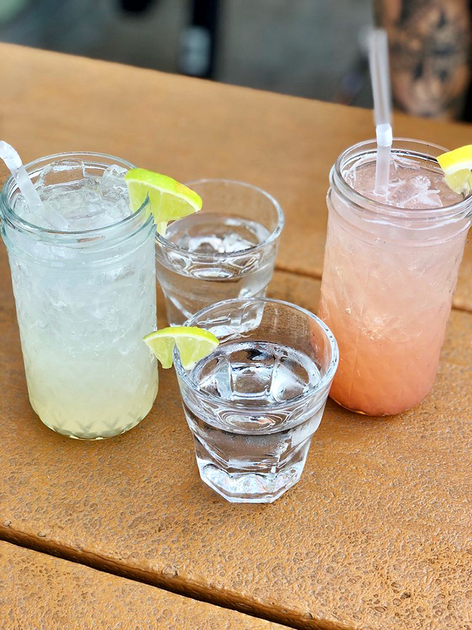 Mason jars filled with colorful concoctions and lime wedges perched just so—because great barbecue deserves equally thoughtful libations.
