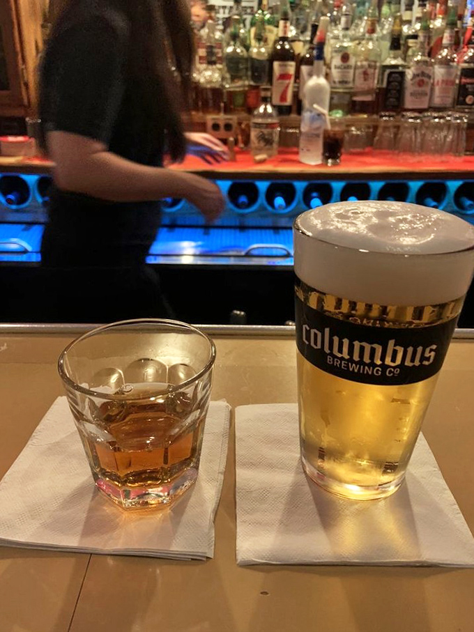 A whiskey neat and Columbus brew—the Midwest's version of sophisticated drinking. No umbrellas, no frills, just honest refreshment after a day of existing.