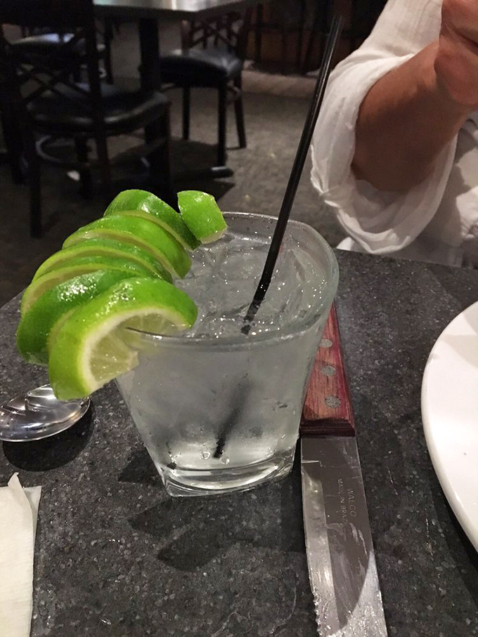 A properly garnished cocktail is like a well-dressed dinner guest—it shows they care about the details. Those lime slices aren't just for show.