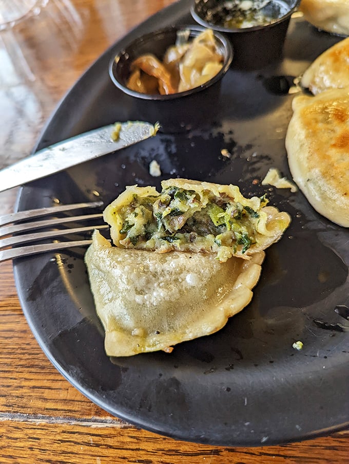 Cut open a pierogi to reveal its secrets—this spinach and cheese filling is the kind of revelation that makes you momentarily forget your table manners.