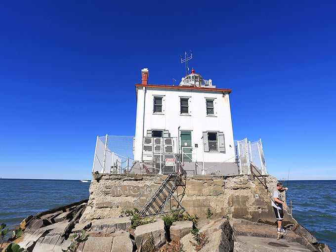 The lighthouse entrance says "keep out" but the view says "come closer"—the eternal contradiction of these beautiful beacons that both welcome and warn.