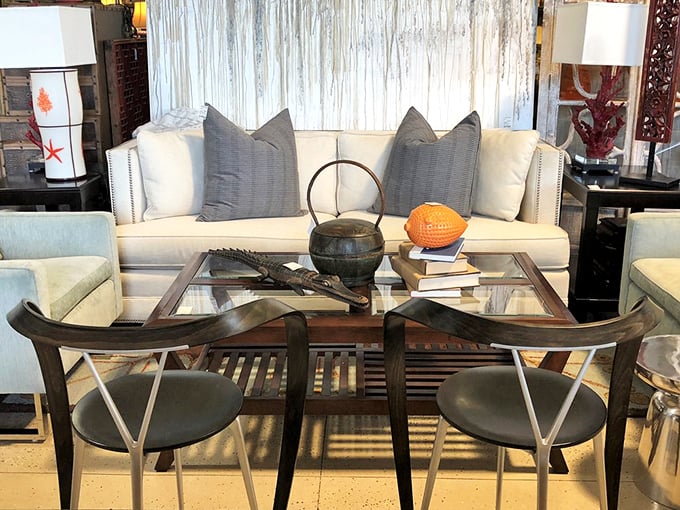 Contemporary meets classic in this vignette where every element—from the glass table to the tailored sofa—speaks of understated luxury.