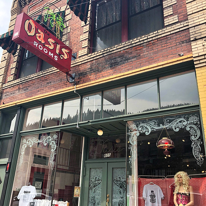 The Oasis Rooms sign hints at Wallace's colorful past, now a museum where visitors can glimpse the town's more risqué history with a wink and a nod.