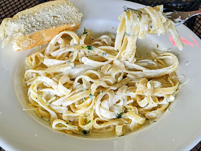 Fettuccine Alfredo so creamy it should come with a warning label: "May cause involuntary food moans and temporary amnesia about calorie counts."