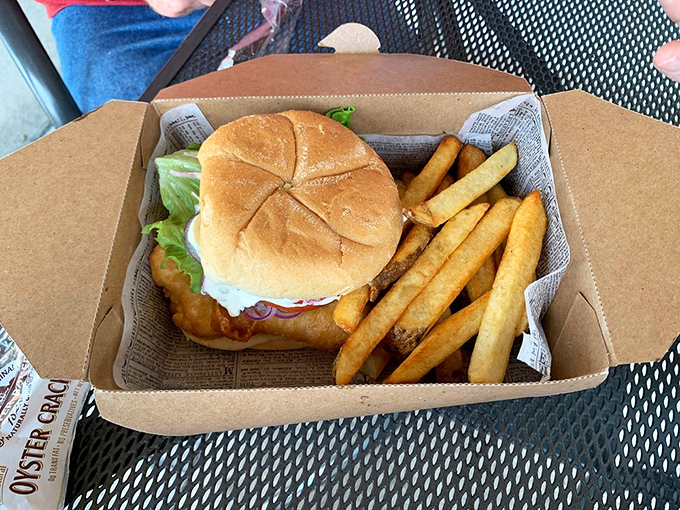 The fish sandwich—where British tradition meets American practicality. Hand-held happiness with that same perfect batter, proving good things come between bread slices too.