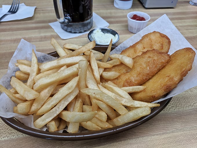Golden fish fillets and hand-cut fries—the kind that make you wonder why anyone bothers with those fancy seafood restaurants when perfection comes on wax paper.
