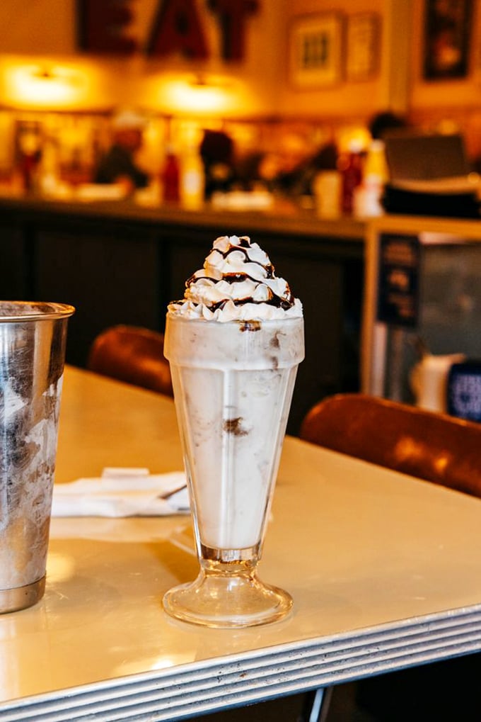 The legendary pie shake in all its glory. Whipped cream mountain atop a glacier of ice cream and pie – proof that sometimes the best innovations are the simplest.