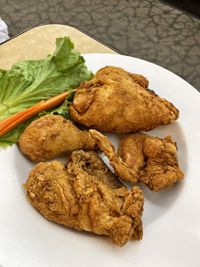 Fried chicken with that golden armor of crispy coating—proof that simple food done right is better than fancy food done wrong.