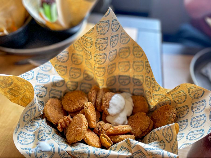Fried pickles: the unsung heroes of any respectable appetizer menu. These golden coins of tangy-meets-crispy deserve their own fan club.