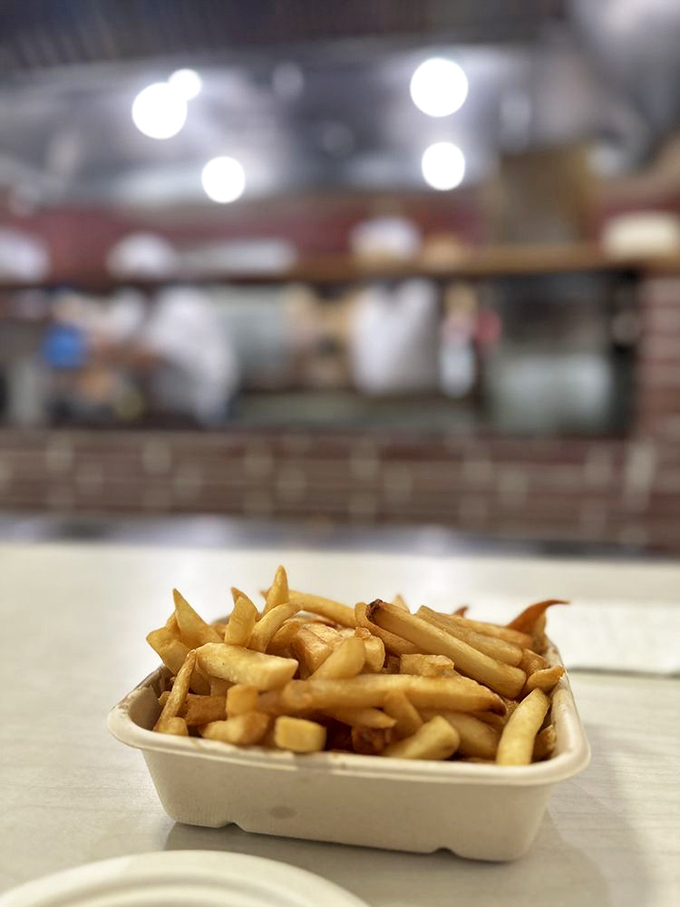 These aren't just fries – they're golden happiness sticks, crispy on the outside, fluffy inside, and worth every minute of the inevitable line.