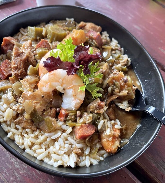 This gumbo doesn't just simmer, it tells stories – rich roux, tender rice, and a medley of seafood in every satisfying spoonful.