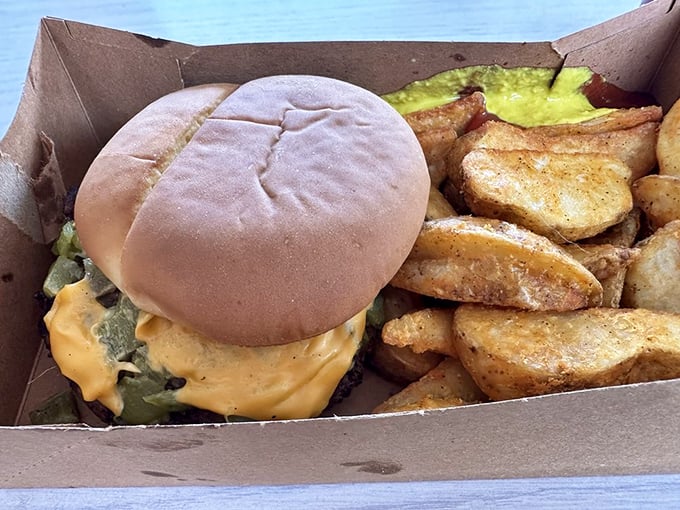 Green chile transforms an ordinary cheeseburger into New Mexican nirvana. This box contains more happiness than most people experience in an entire afternoon.