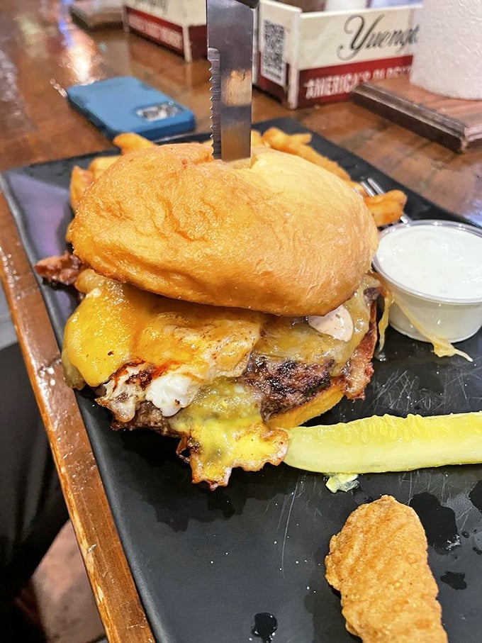 This burger doesn't just have layers, it has chapters—a novel of melted cheese, perfectly charred beef, and a bun that somehow maintains its dignity throughout.