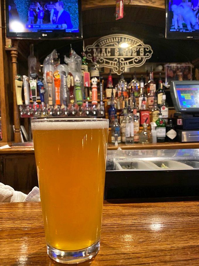A perfectly poured golden IPA catching the bar light just right. Beer isn't just a beverage here—it's a supporting character in your Oxford story. 