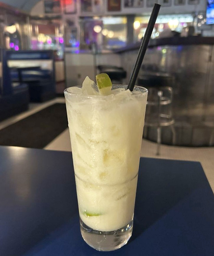 Cocktail o'clock at the diner—this frosty concoction with a lime garnish proves that sometimes the best food groups are "frozen" and "refreshing."